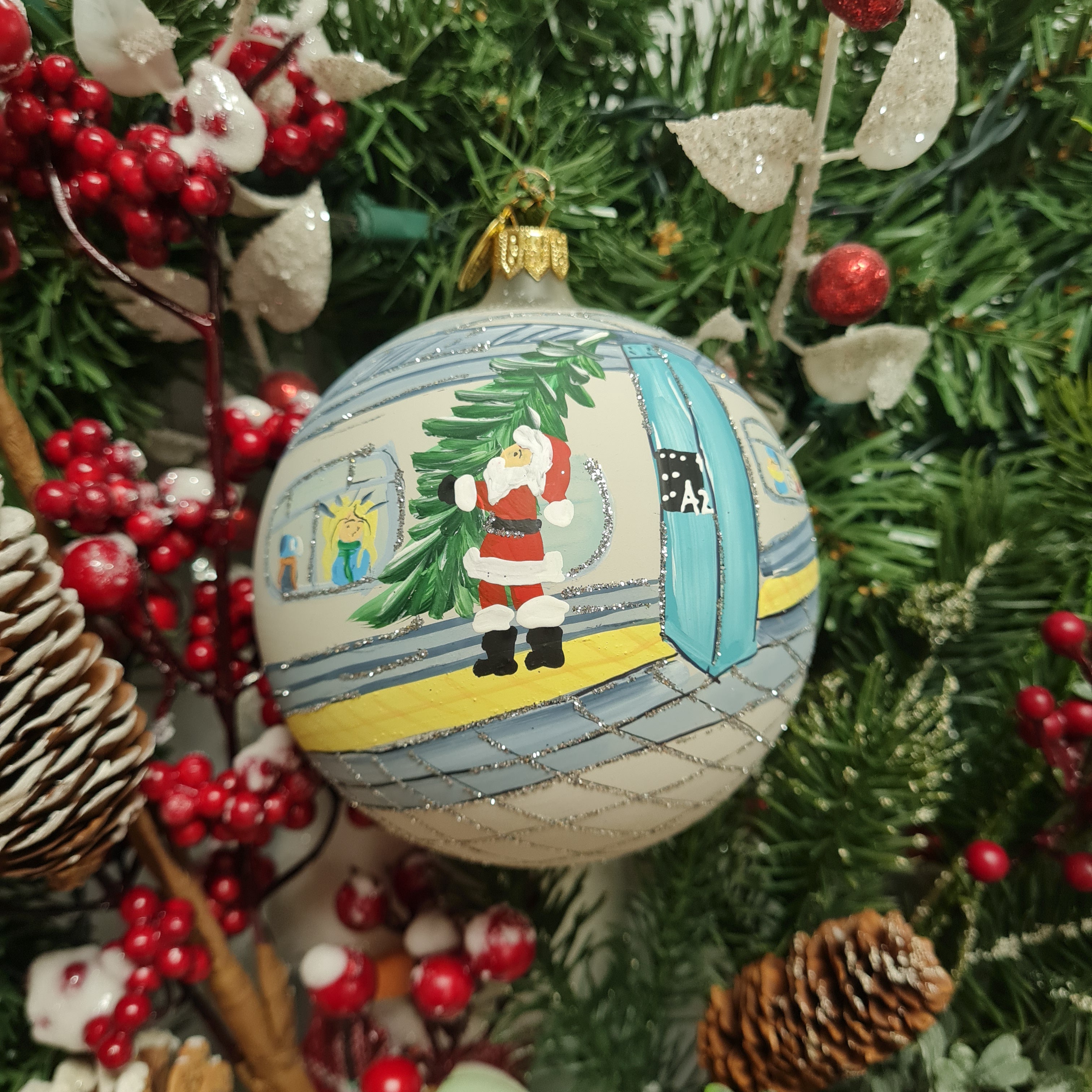 SANTA CARRYING TREE IN THE SUBWAY GLASS BALL – Christmas and City